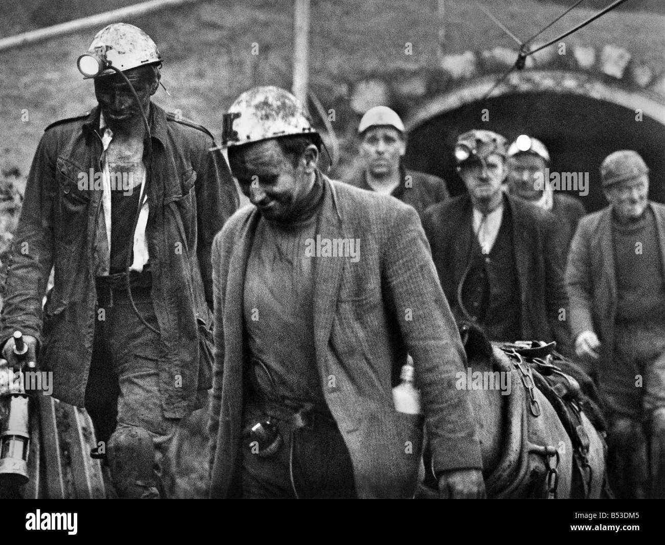 Miners who took part in the BBC2 serial "Germinal" leaving the pit ...
