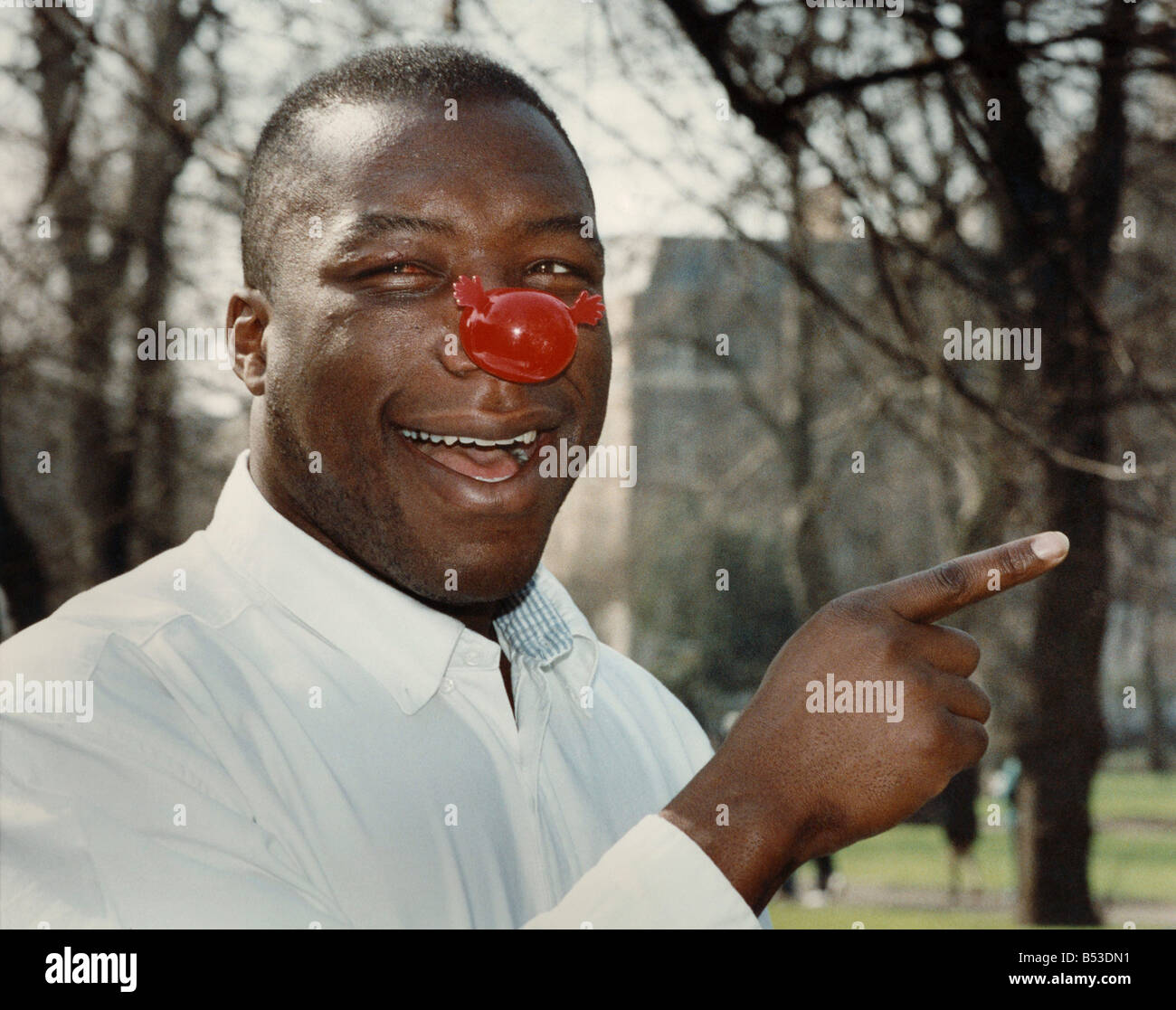 Comic relief. Former Boxing champion Gary Mason sports a comic red nose ...