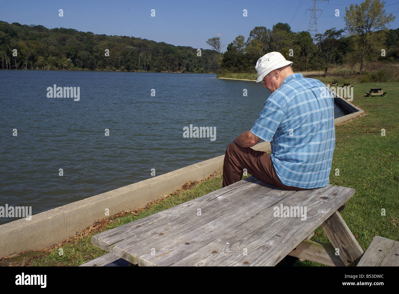 Sad man sit picnic table hi-res stock photography and images - Alamy