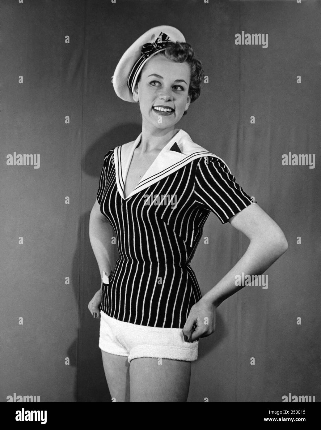 Clothing Beachwear. ;Model wears sailors hat, striped fitted naval ...