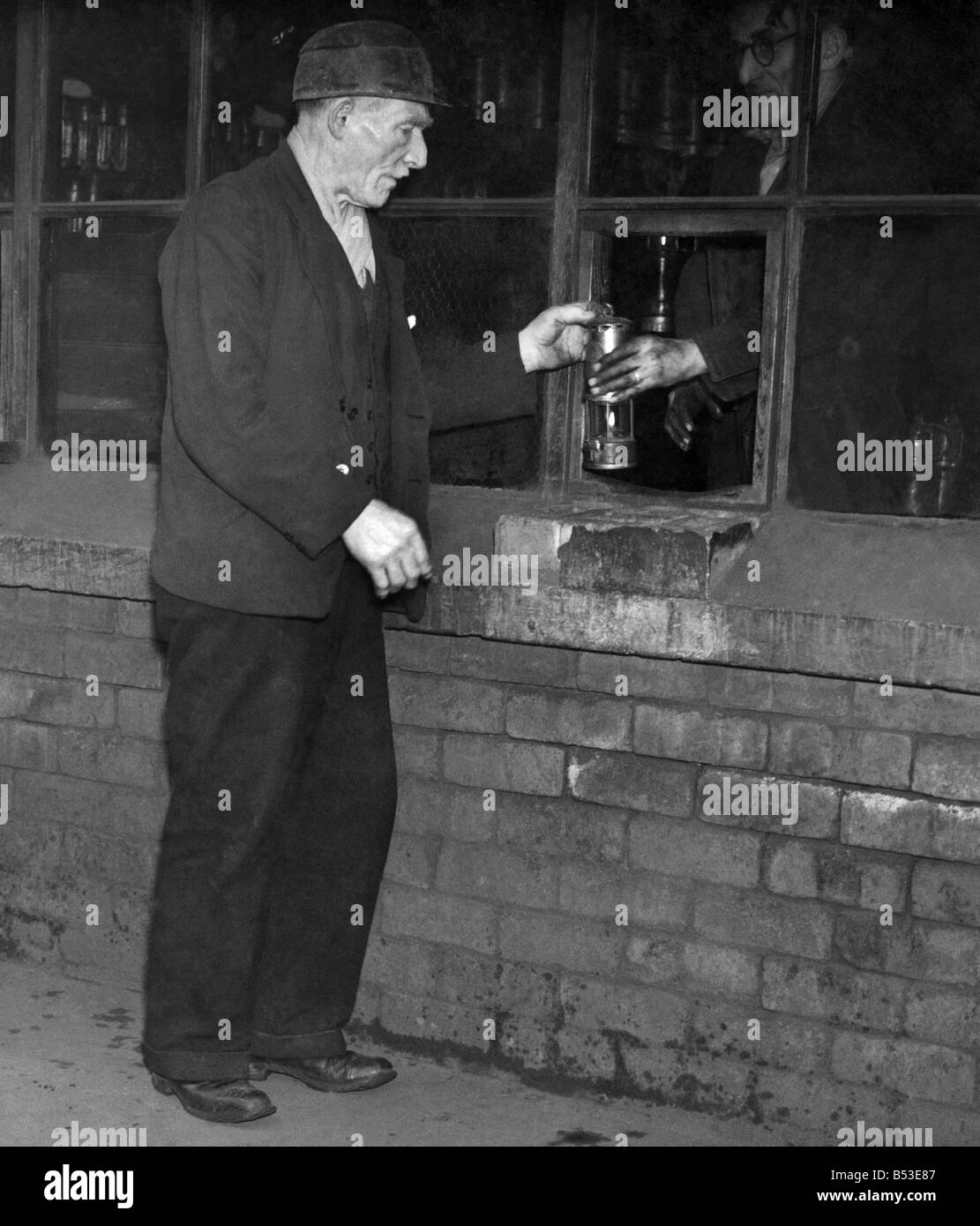 Eighty years old Joseph Brogan collecting his lamp prior to working his ...
