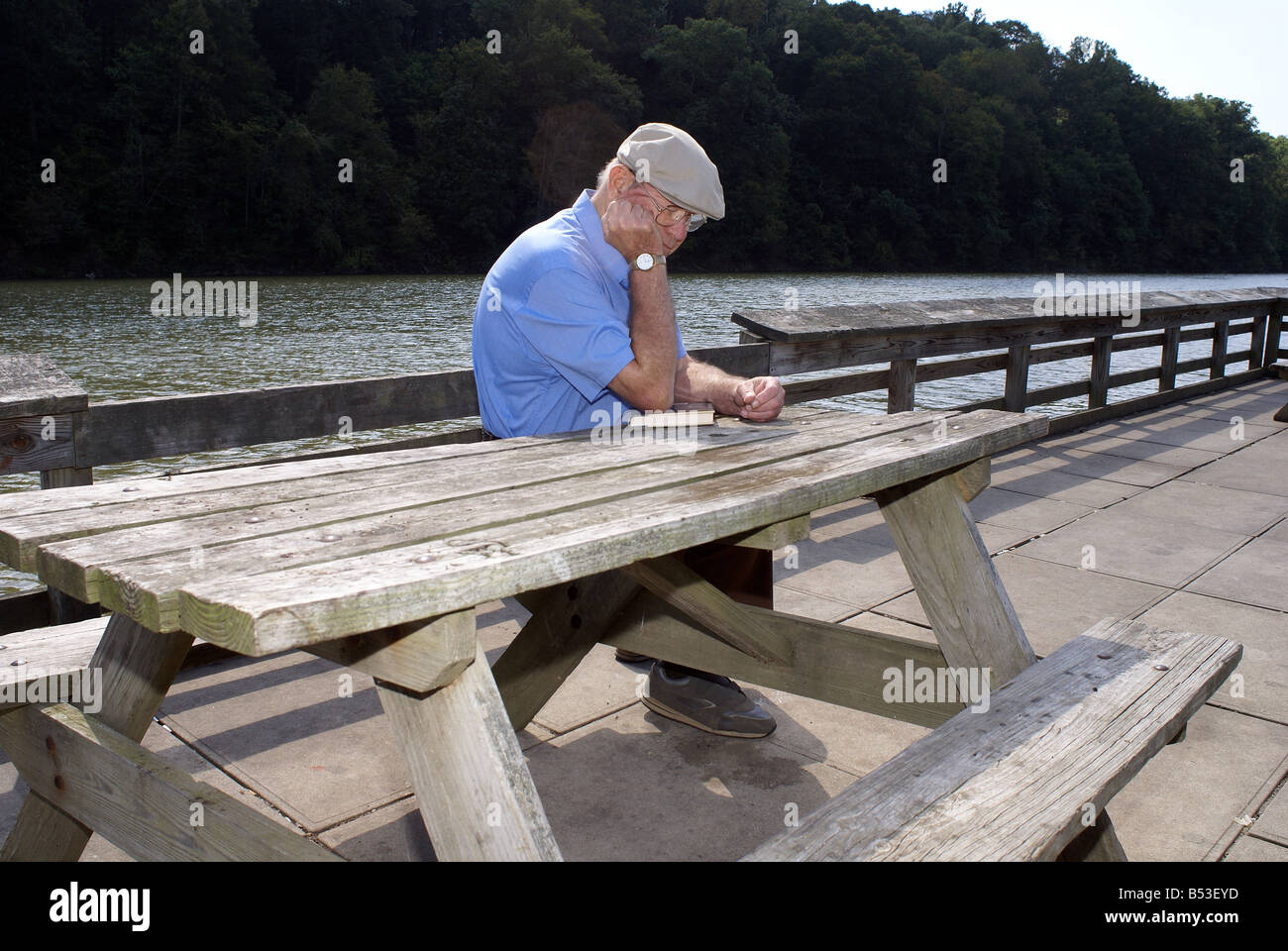 Sad man sit picnic table hi-res stock photography and images - Alamy