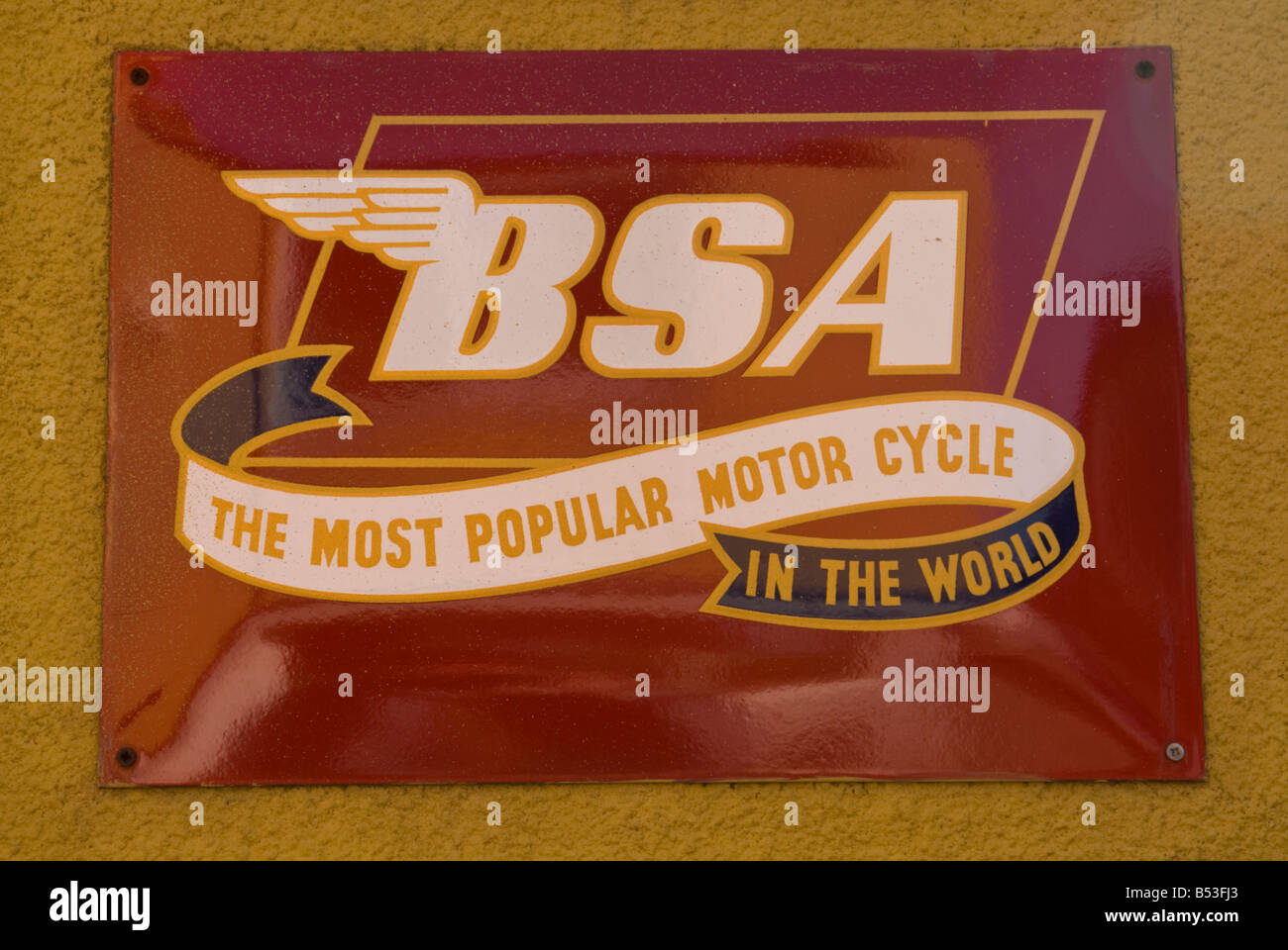 Metal plaque with the BSA motorcycle logo on wall outside uk motorbike ...