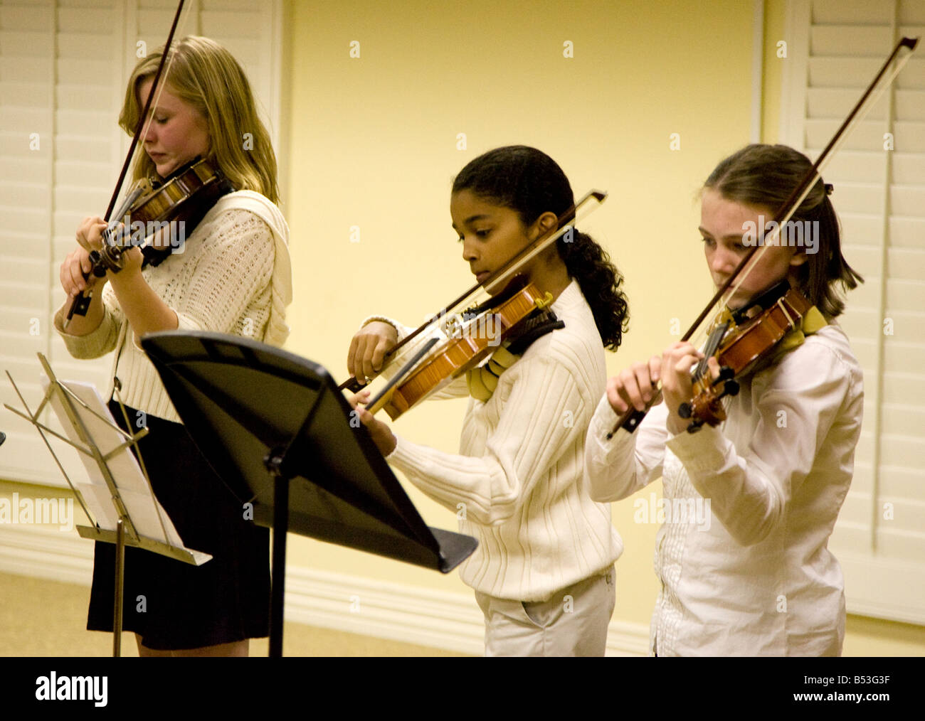 Three Young Violin Students Stock Photo - Alamy