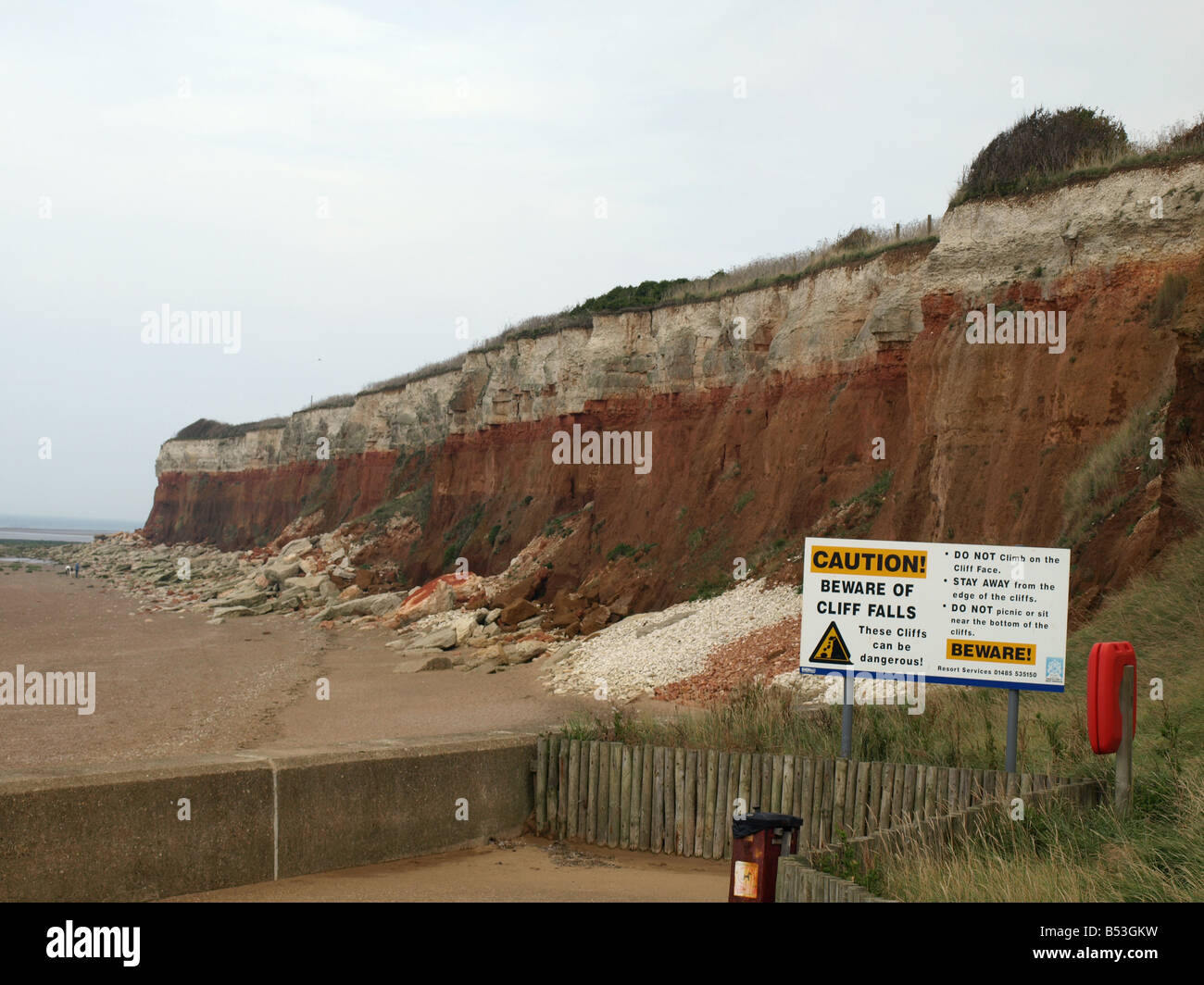 The crumbling cliffs with warning notice at Hunstanton,Norfolk,East ...