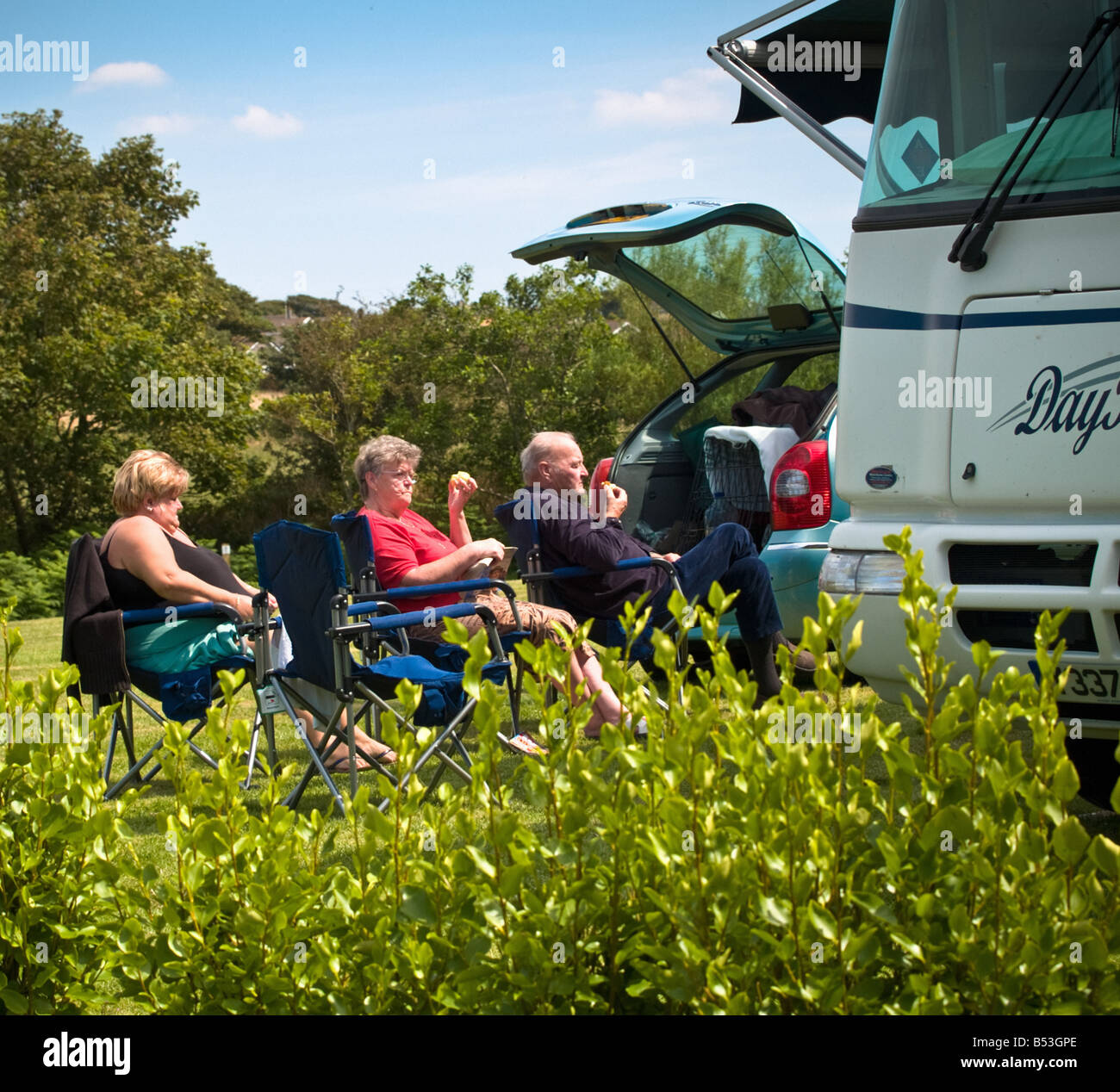 Elderly people enjoying camping holiday, Four Lanes, Cornwall Stock ...