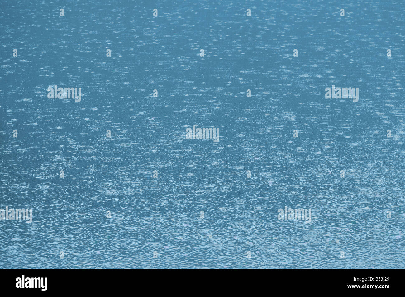Rain on the lake Stock Photo - Alamy