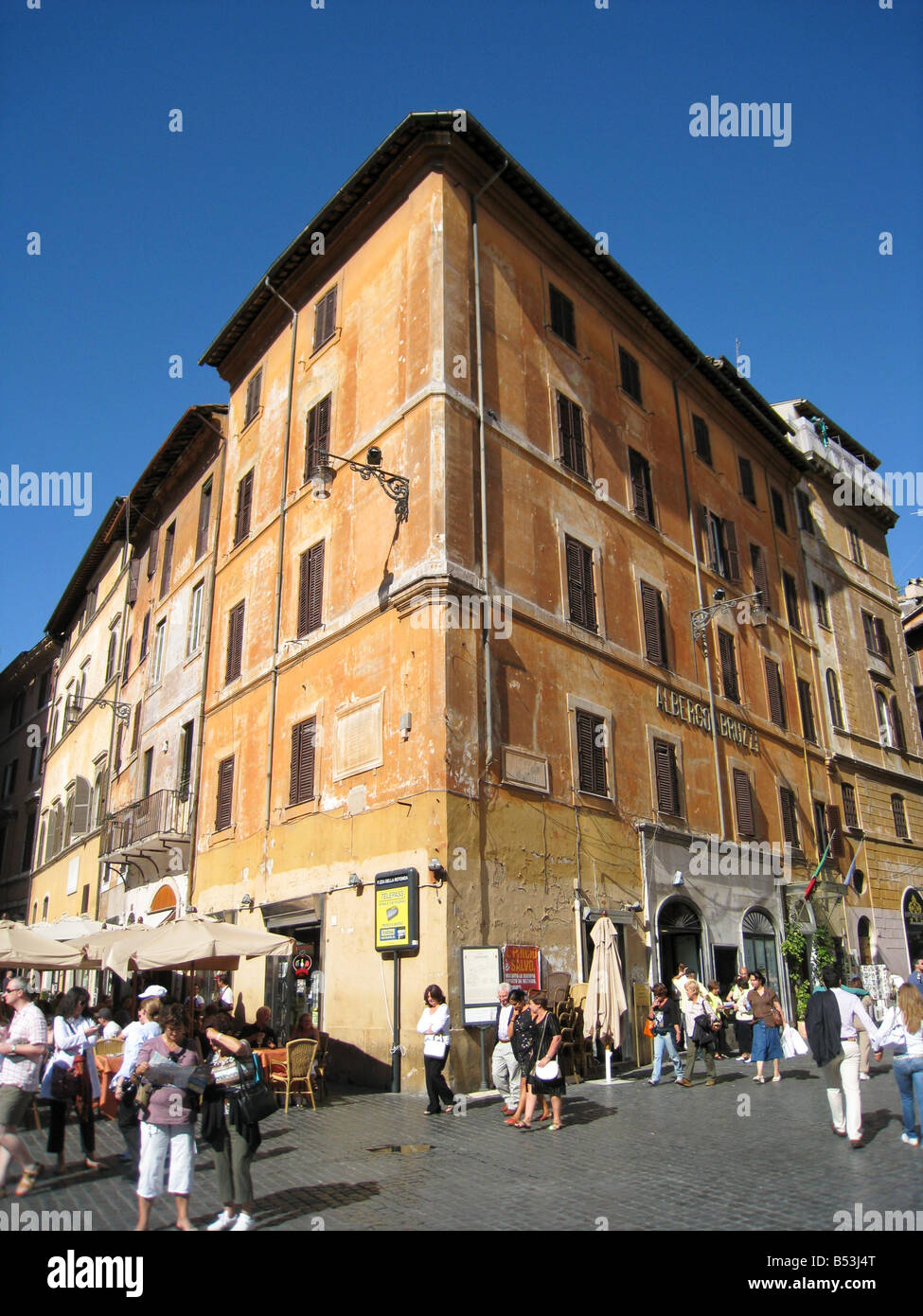 Albergo Abruzzi hotel building with ocre wall and brown window shutters ...