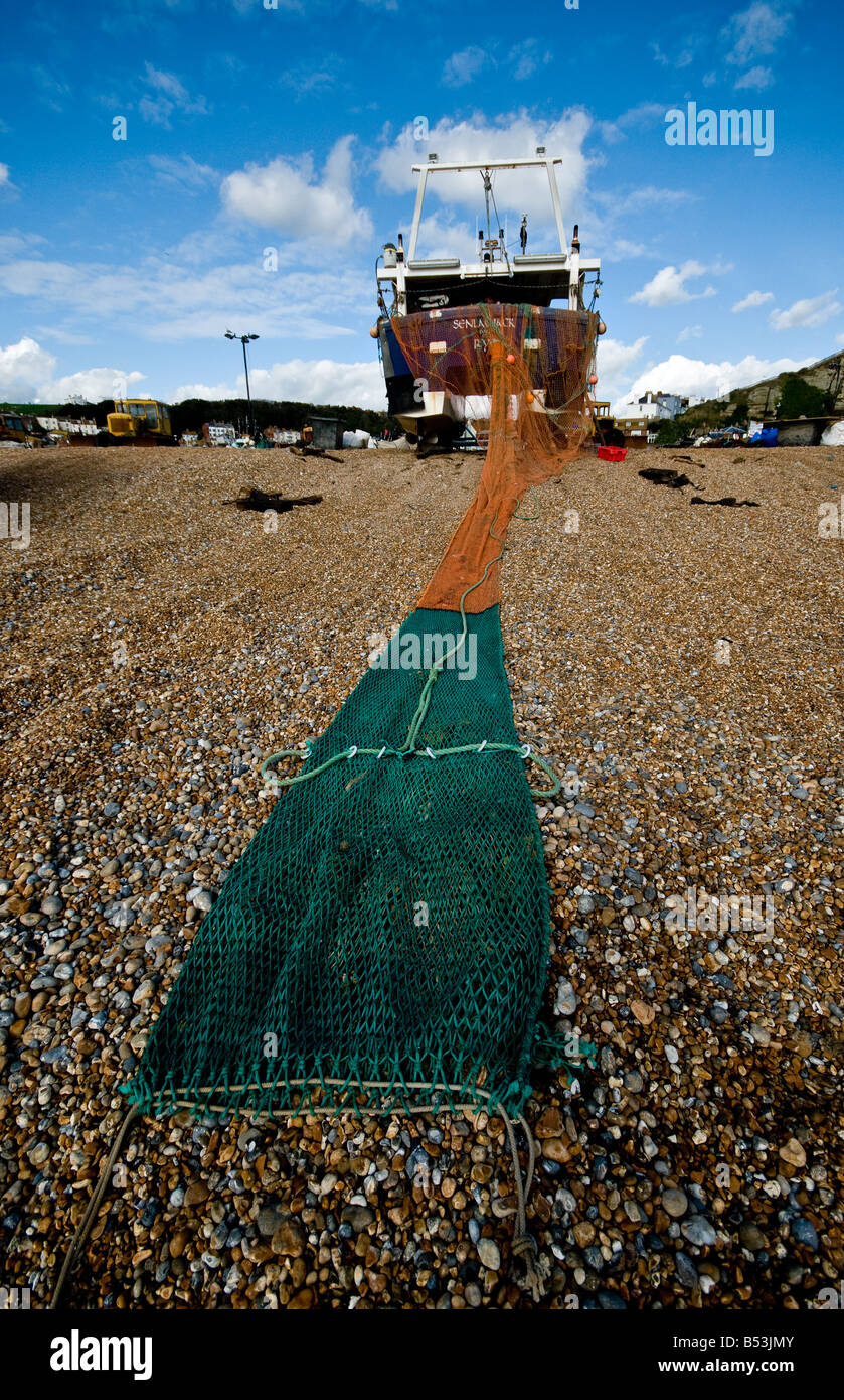Fishing net hanging off the stern of a beached fishing boat on the ...