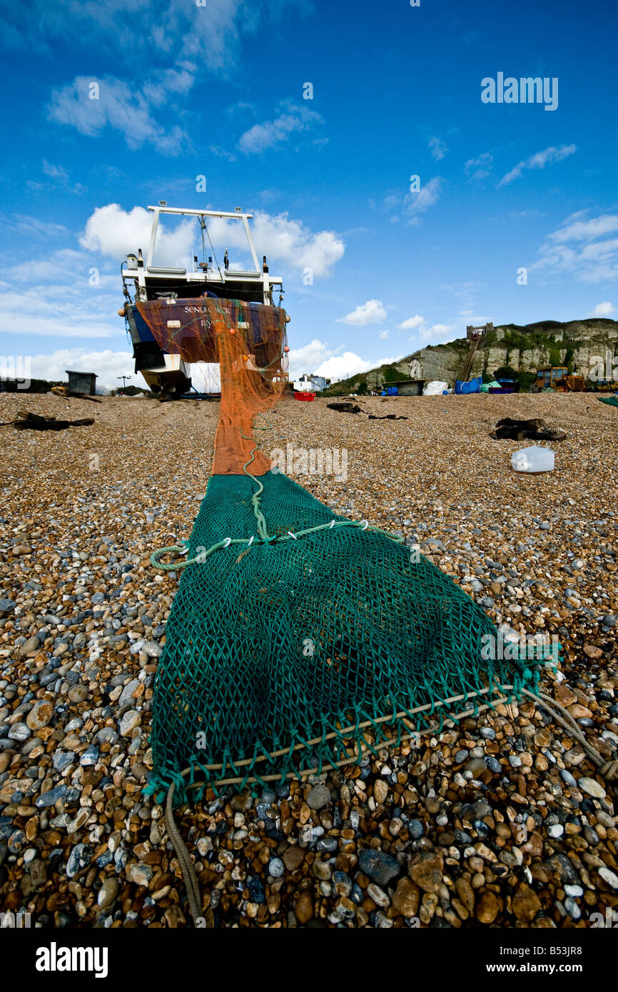 Fishing net hanging off the stern of a beached fishing boat on the ...