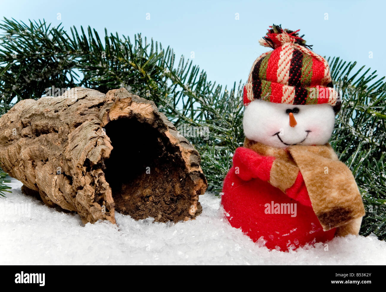 Little fake snowman with christmas clothes in the snow Stock Photo - Alamy