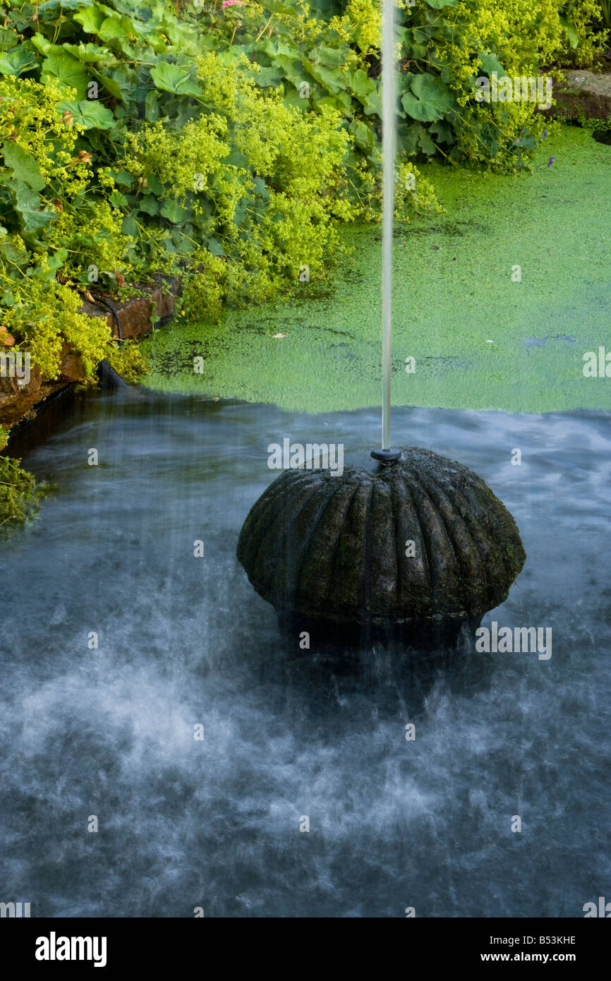 water splashing around a stone fountain Stock Photo - Alamy