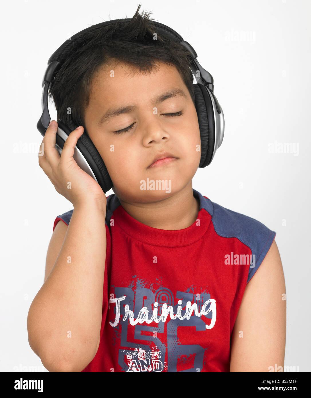 asian child listening to music Stock Photo - Alamy