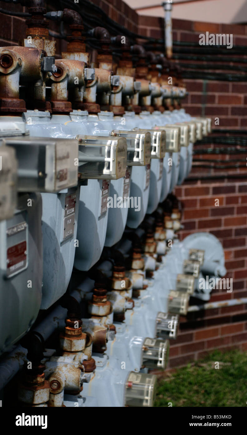 Row of natural gas meters on a brick wall Stock Photo - Alamy
