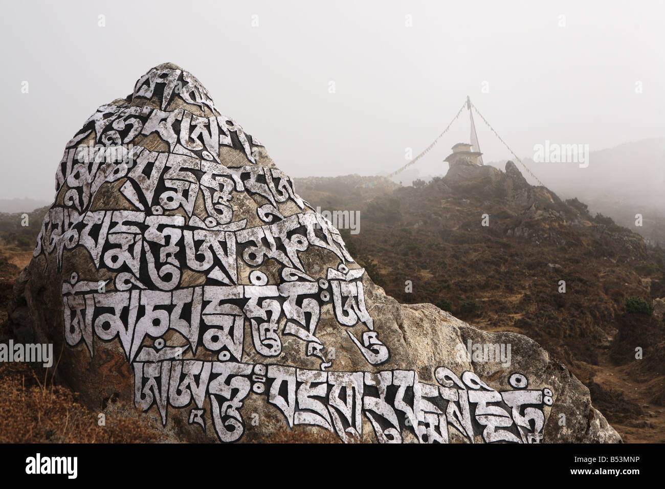 The haunting scene of prayer rocks and rolling mist, Everest, Nepal ...