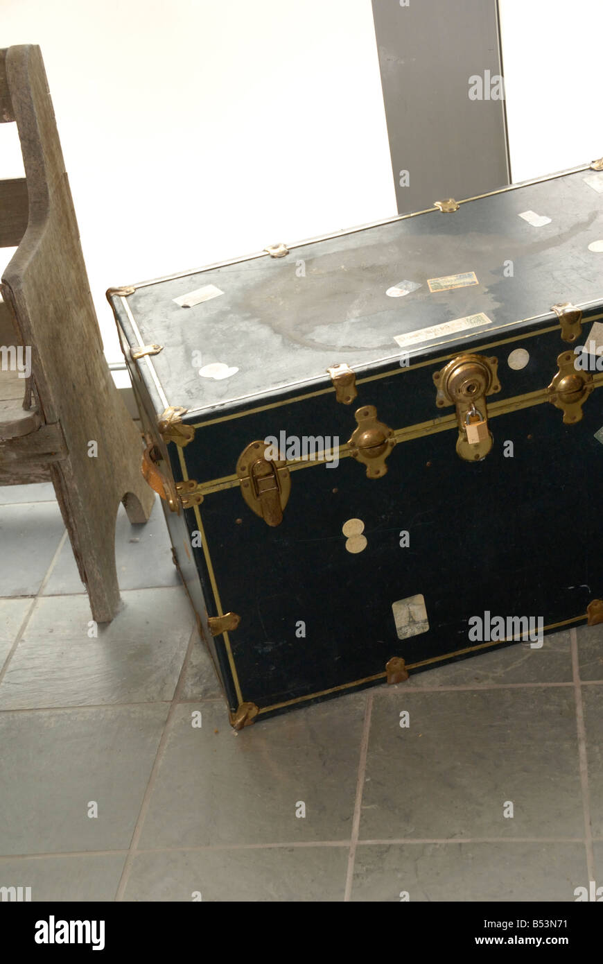 Old trunk with travel stickers Stock Photo - Alamy