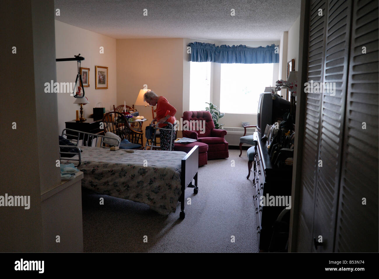 Old woman walker in apartment hi-res stock photography and images - Alamy