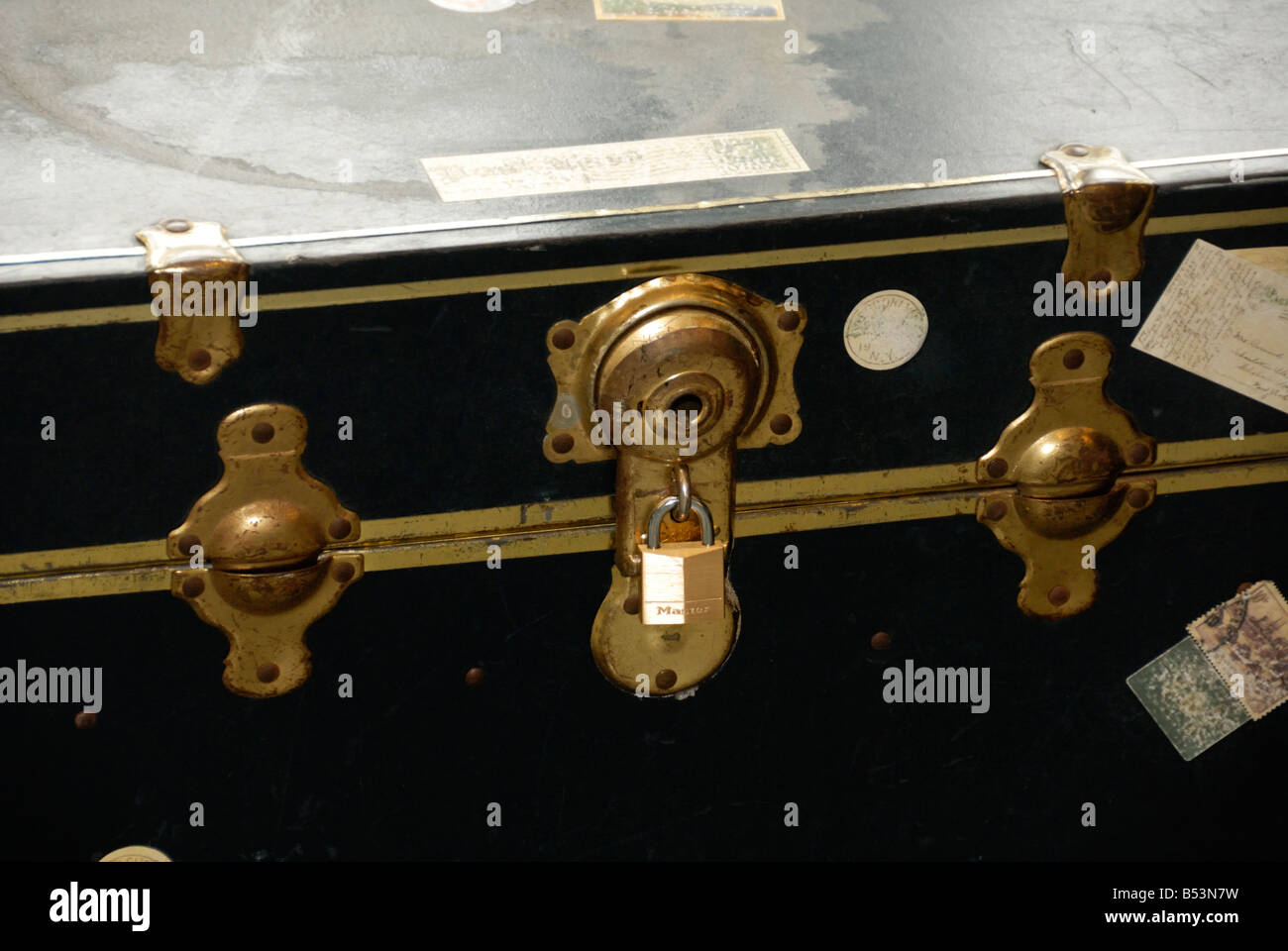 Old trunk with travel stickers Stock Photo - Alamy