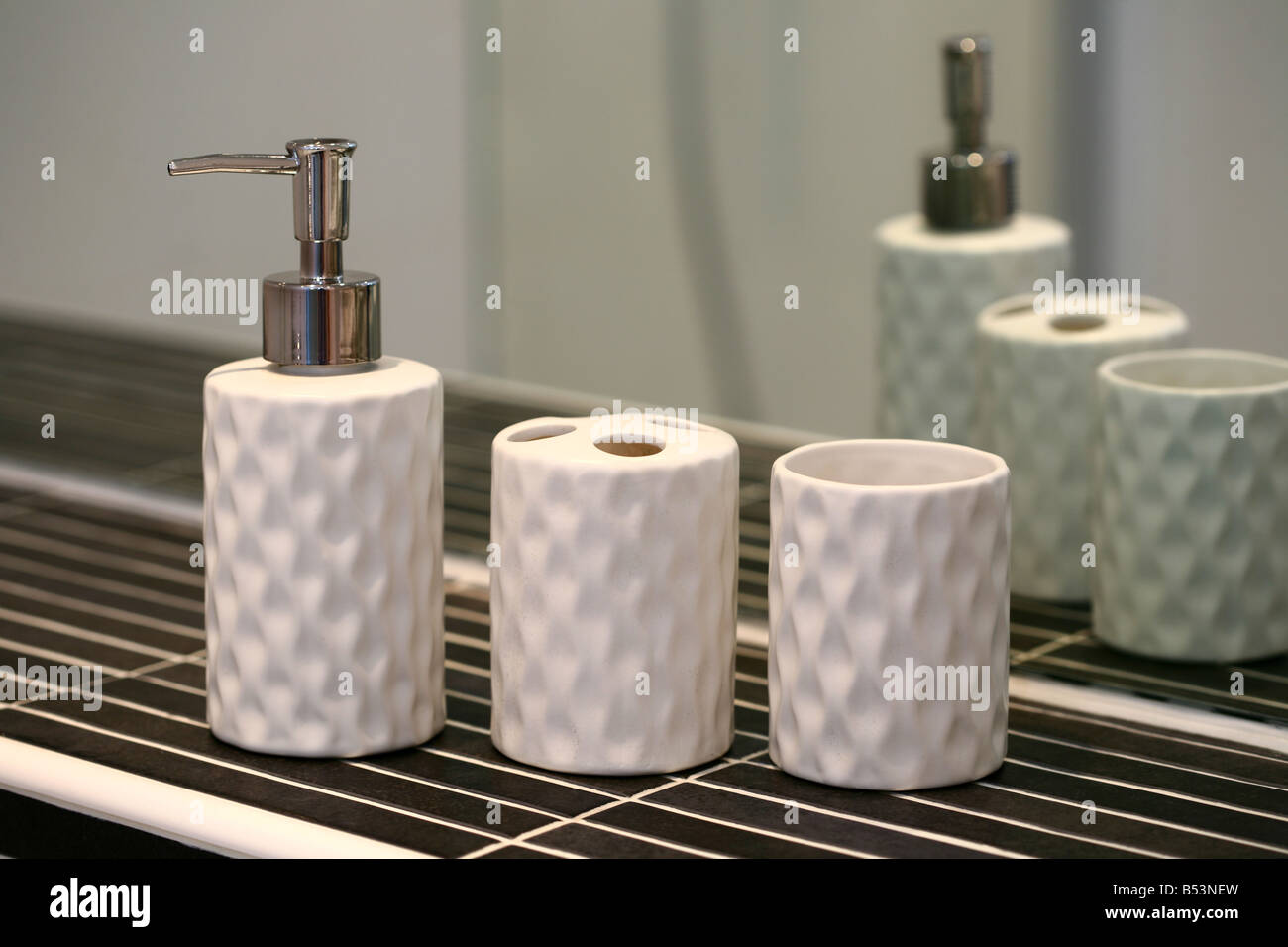 Set of three Bathroom dispensers Stock Photo - Alamy
