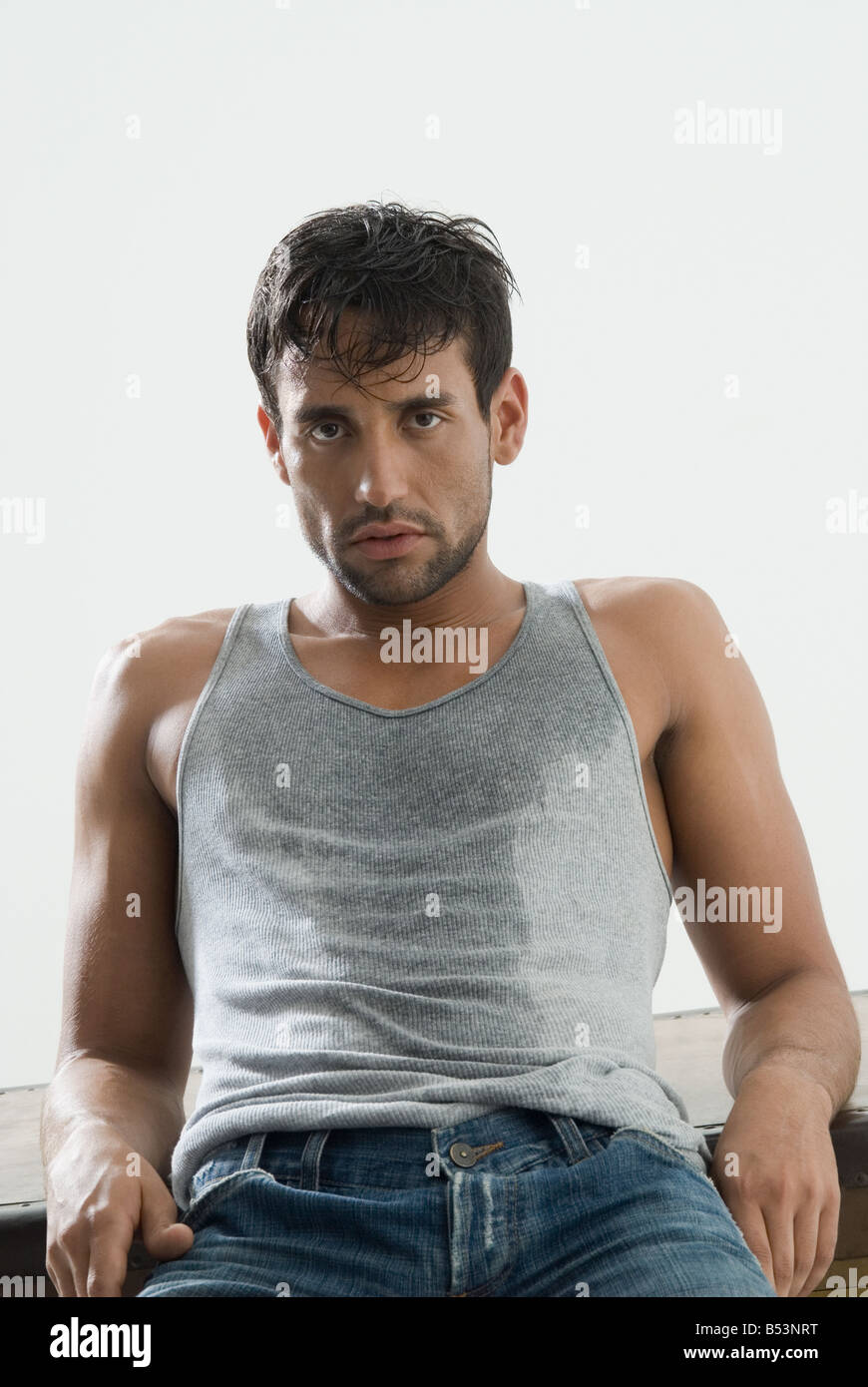 Hispanic man reclining Stock Photo - Alamy