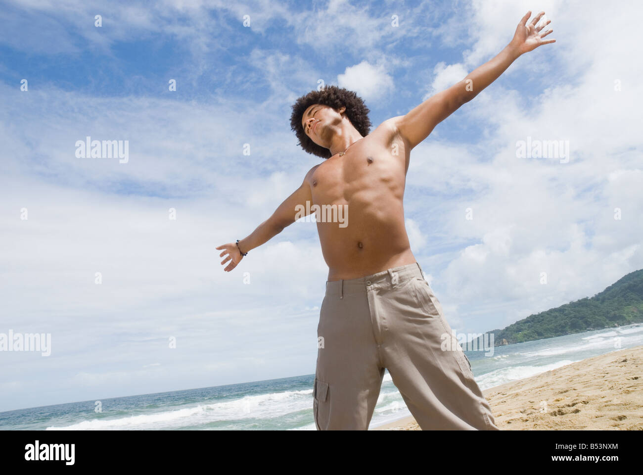 African man relaxing at beach Stock Photo - Alamy