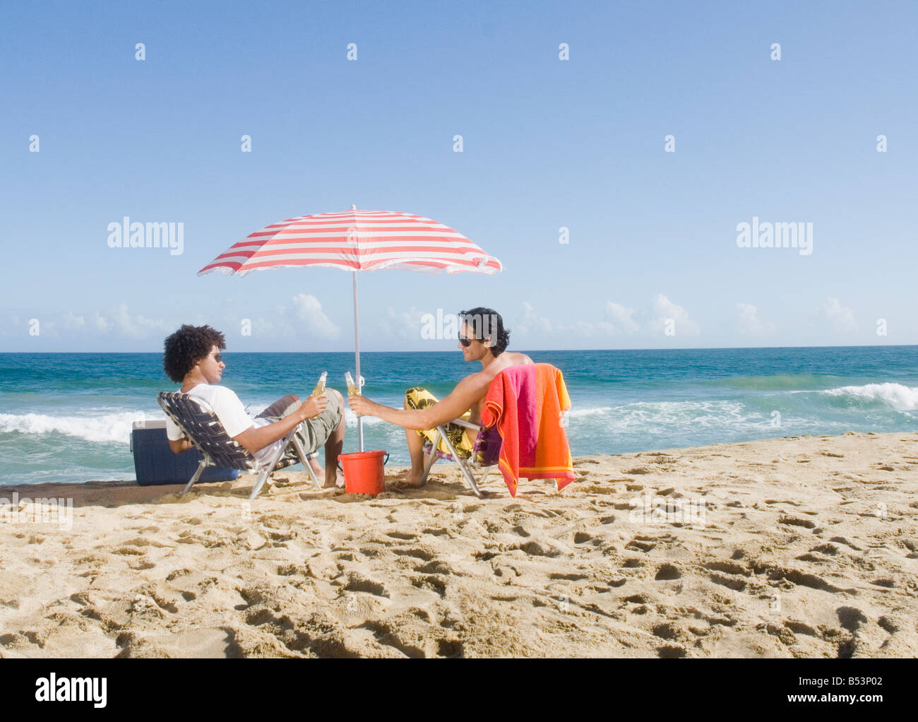 Two men beach beer hi-res stock photography and images - Alamy