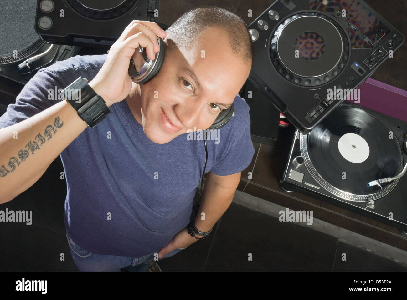Hispanic DJ performing in nightclub Stock Photo - Alamy