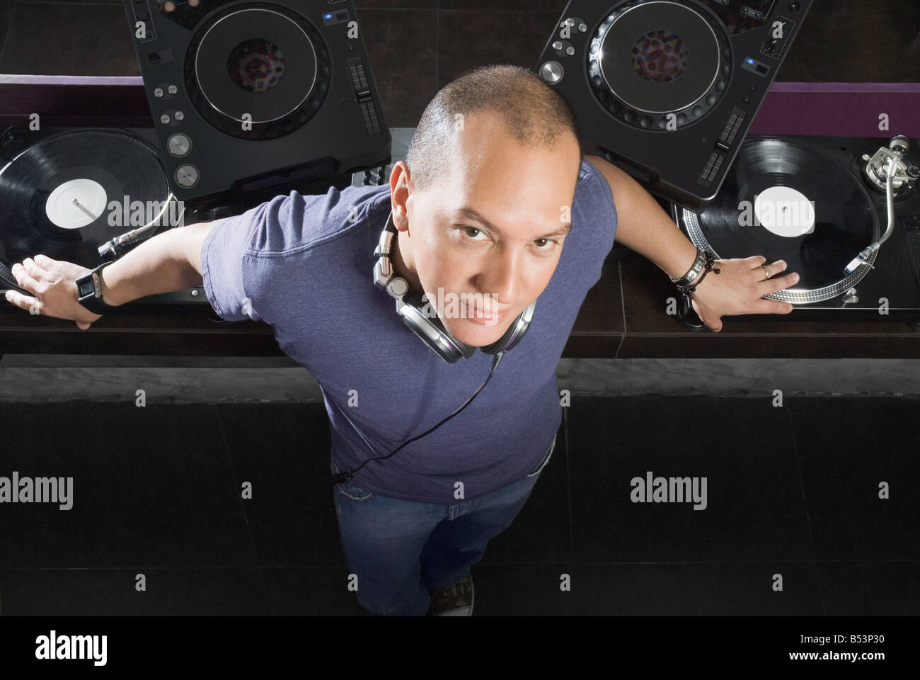 Hispanic DJ performing in nightclub Stock Photo - Alamy