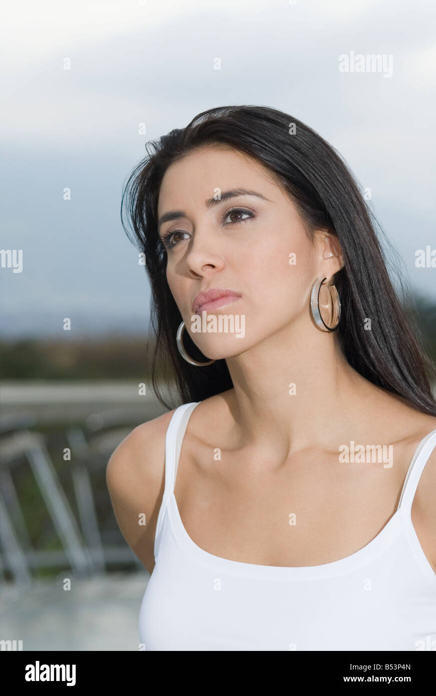 Serious Hispanic woman Stock Photo - Alamy