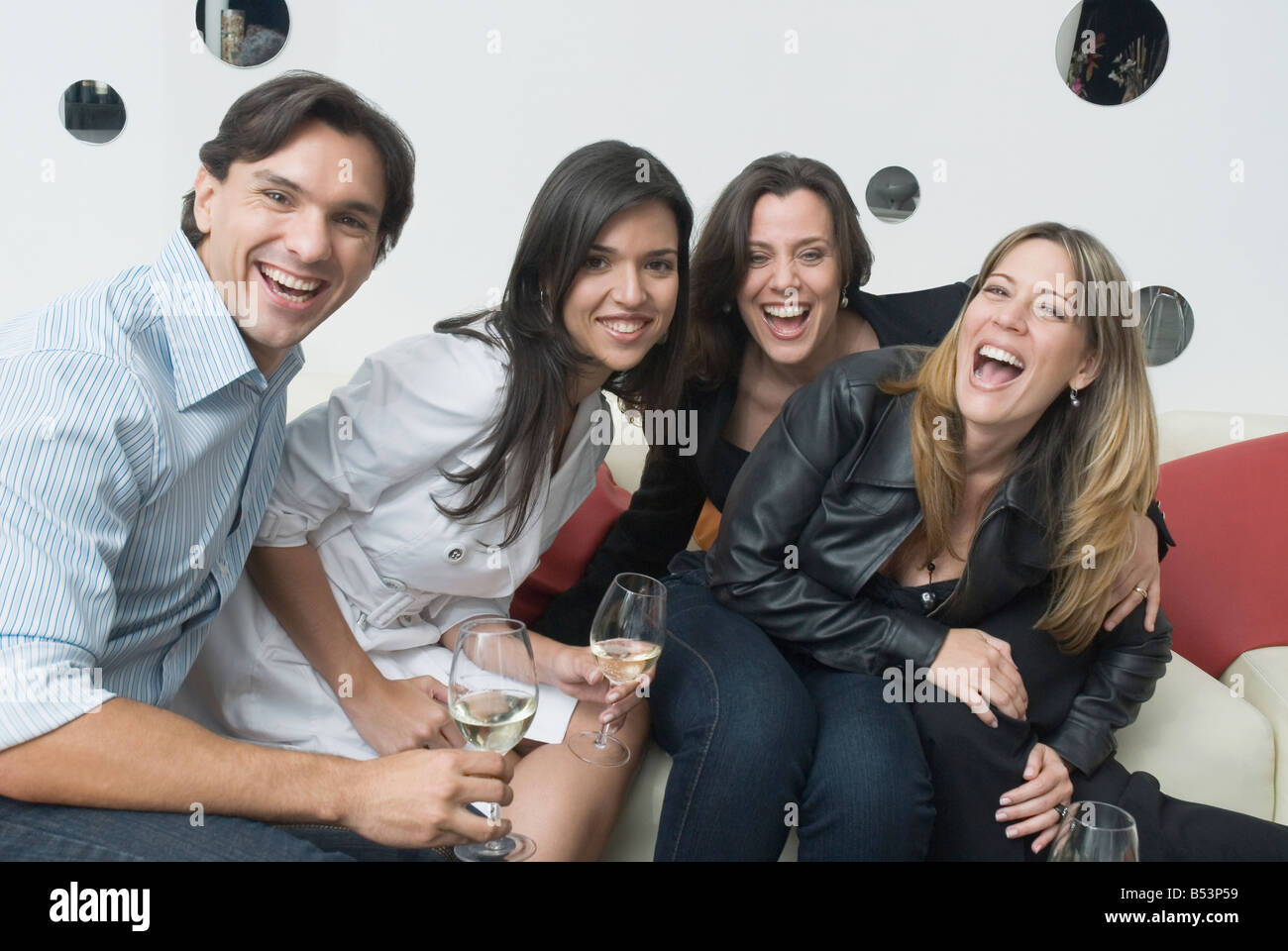 Hispanic friends drinking in nightclub Stock Photo - Alamy