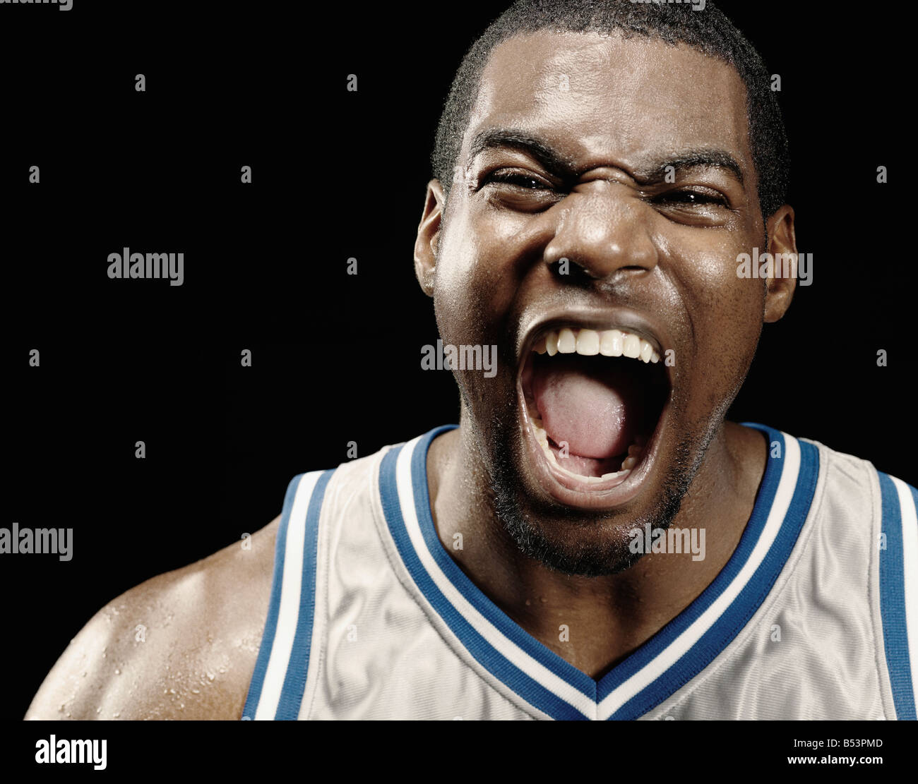 African basketball player shouting Stock Photo - Alamy