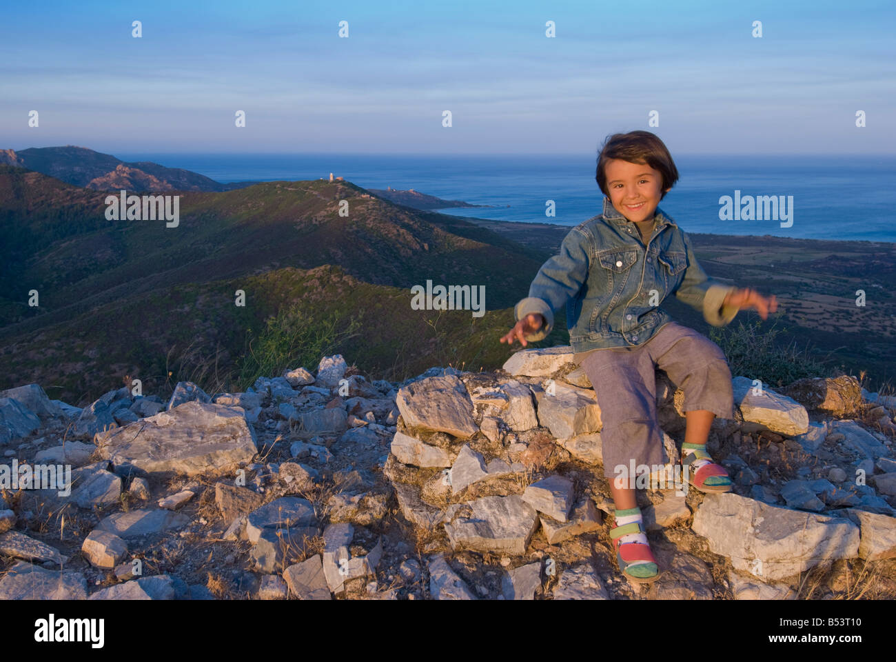 young boy smiling Italy Sardinia mountains and sea of Quirra area Stock ...