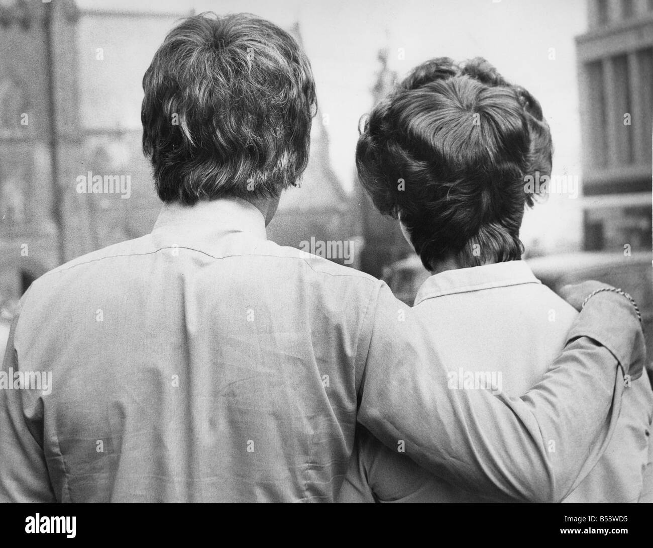 A young couple enjoy a cuddle Stock Photo - Alamy