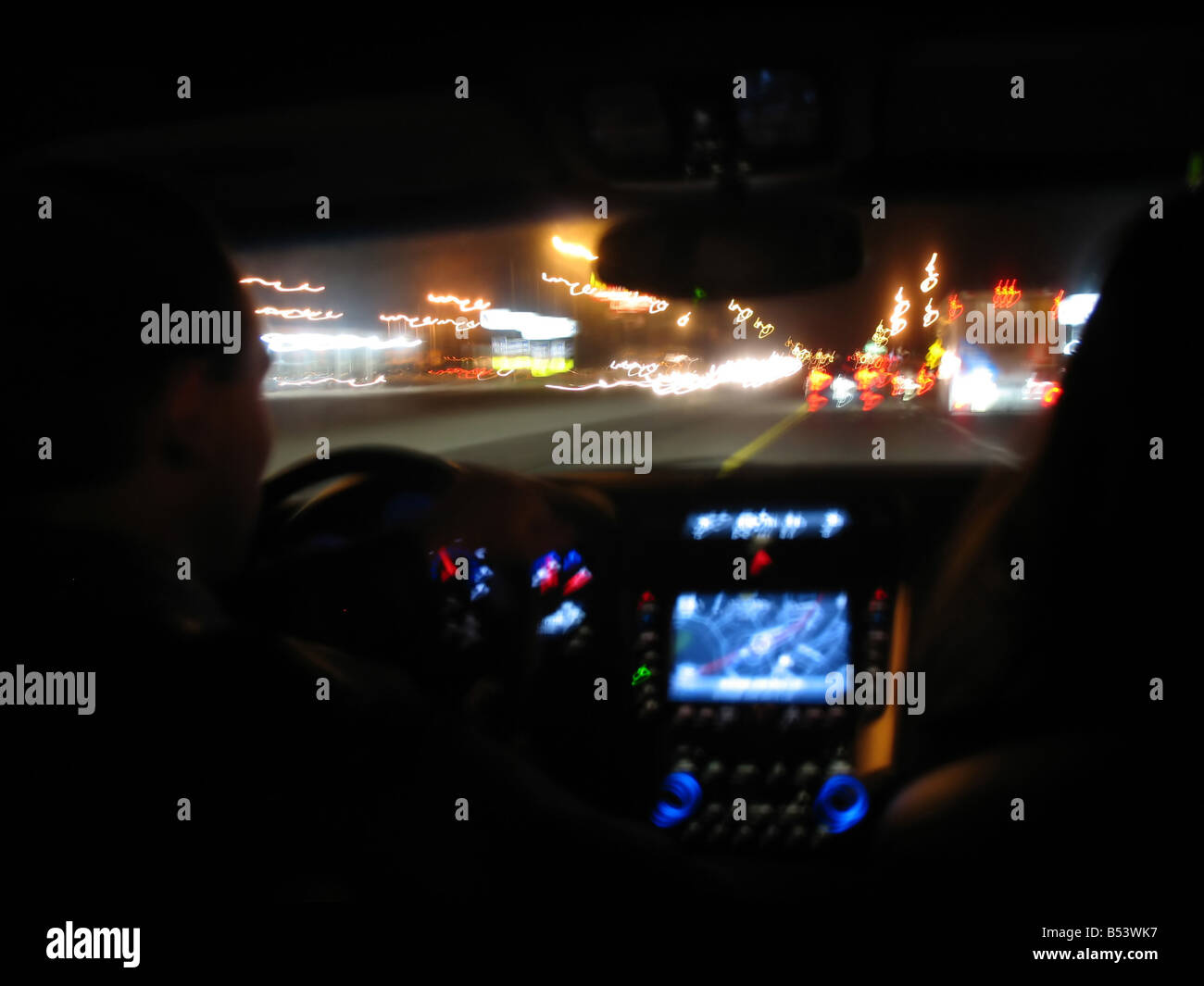 Driving at night in a modern luxury vehicle Stock Photo - Alamy