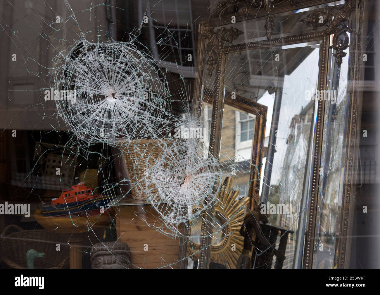 Smashed shop window Stock Photo - Alamy