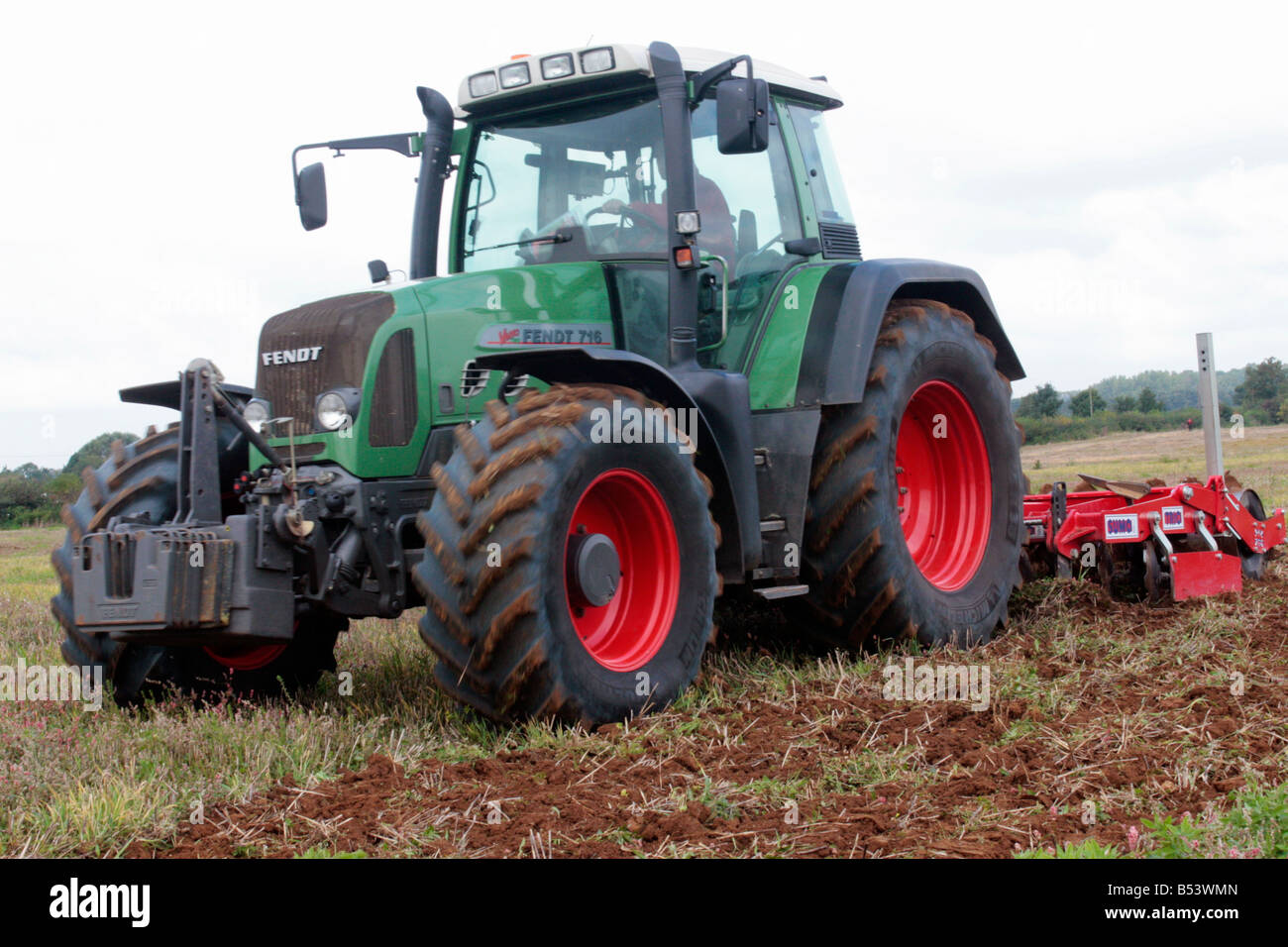 A farmer driving with his Fendt tractor Stock Photo - Alamy