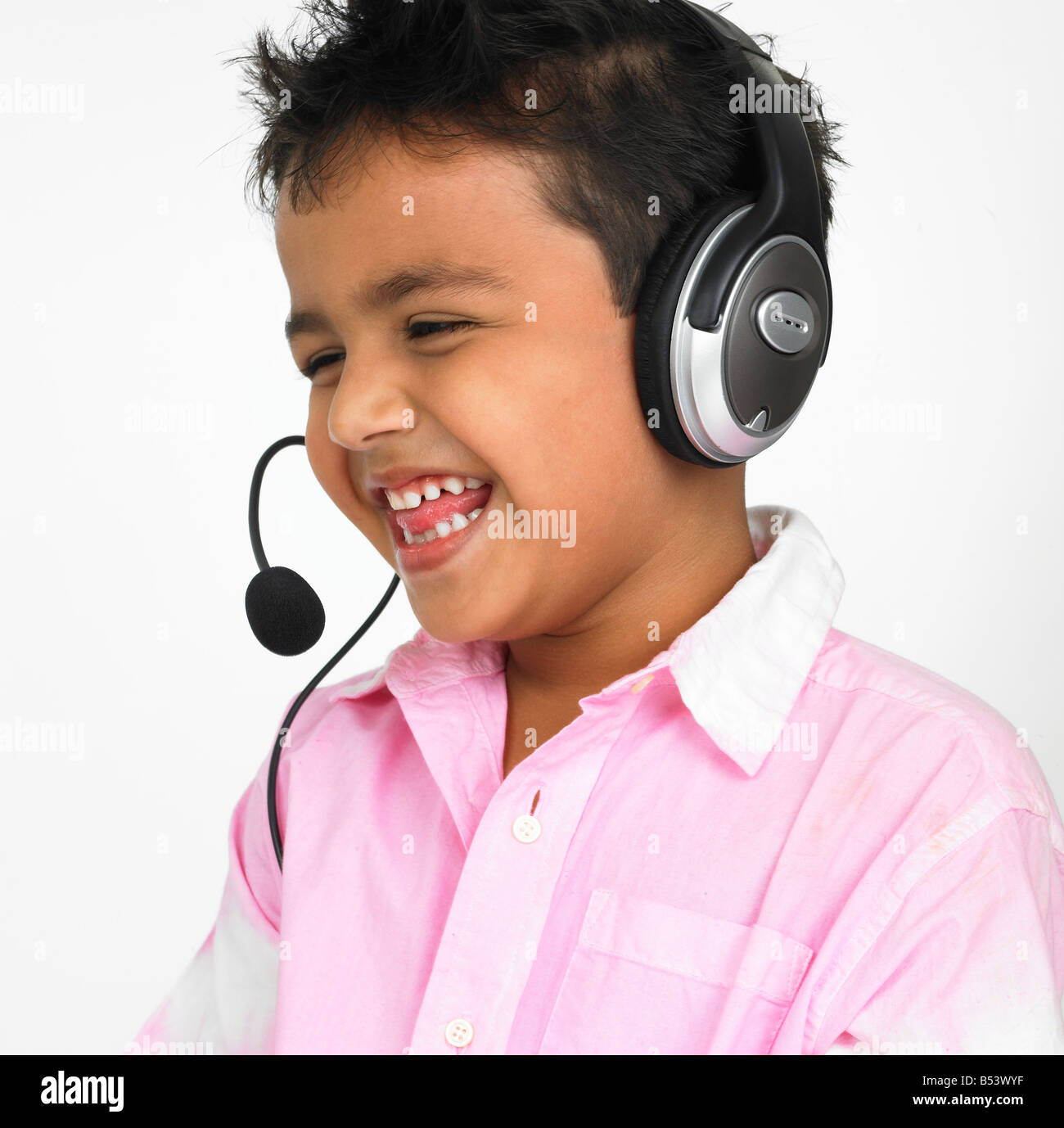 Asian boy with headphones Stock Photo - Alamy