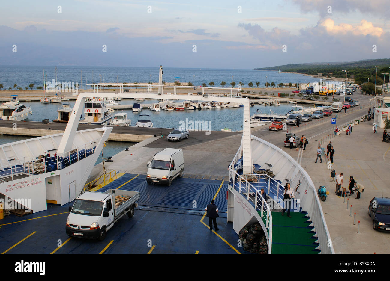 Cars getting on the ferry in Supetar harbour on the island of Brac ...
