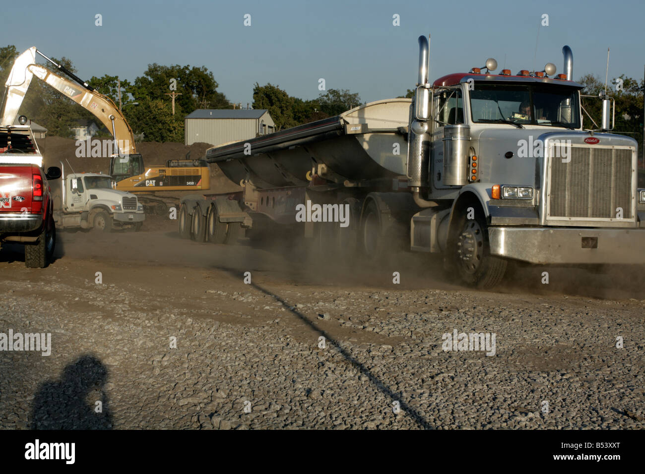 Truck leaving work site Stock Photo - Alamy