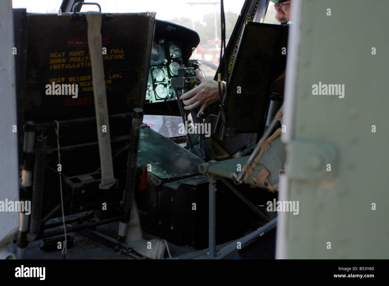 Cargo area interior of a Huey helicopter looking between seats in ...