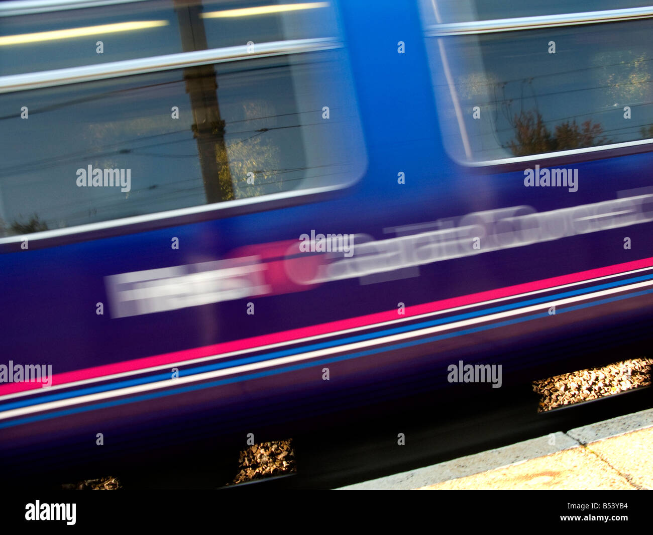 First Capital Connect train passing through station at speed Stock ...