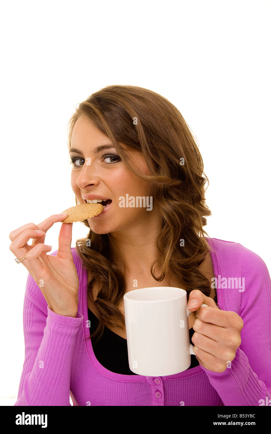 Woman eating biscuit hi-res stock photography and images - Alamy
