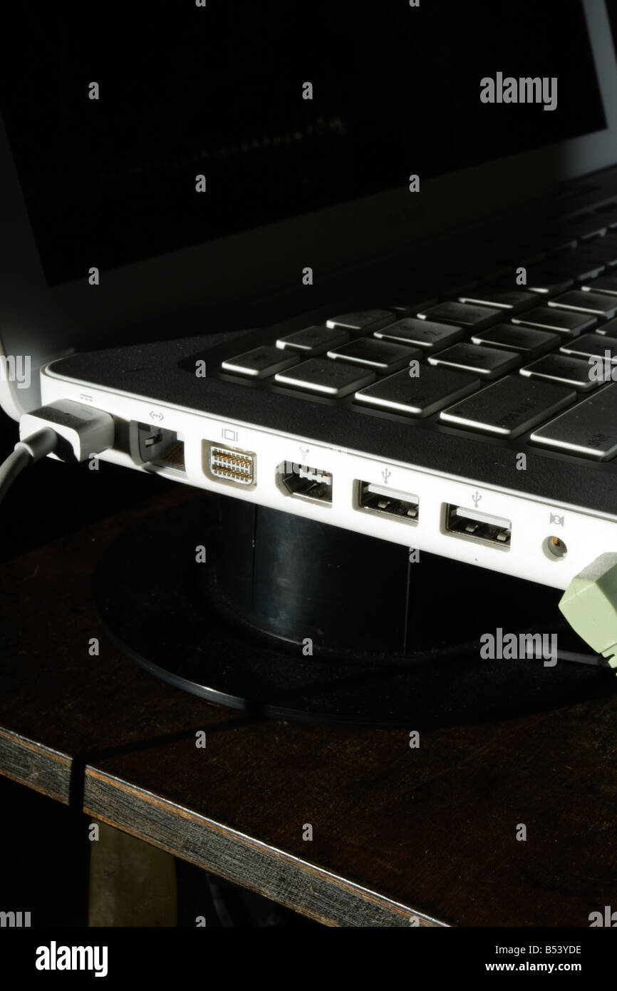 Ports on a white MacBook laptop computer Stock Photo - Alamy
