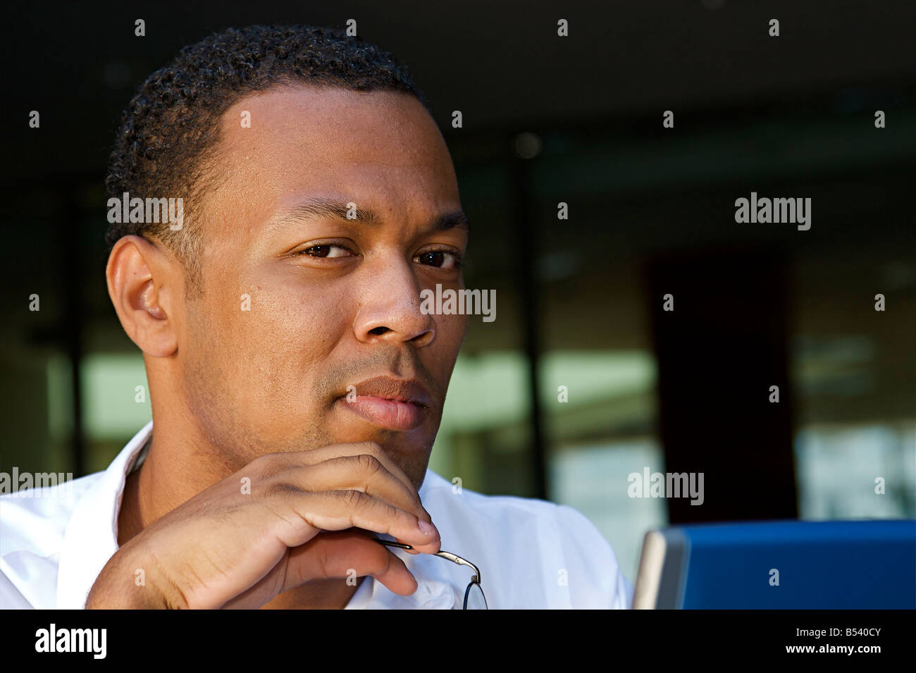 An confident and successful African American businessman in a power ...