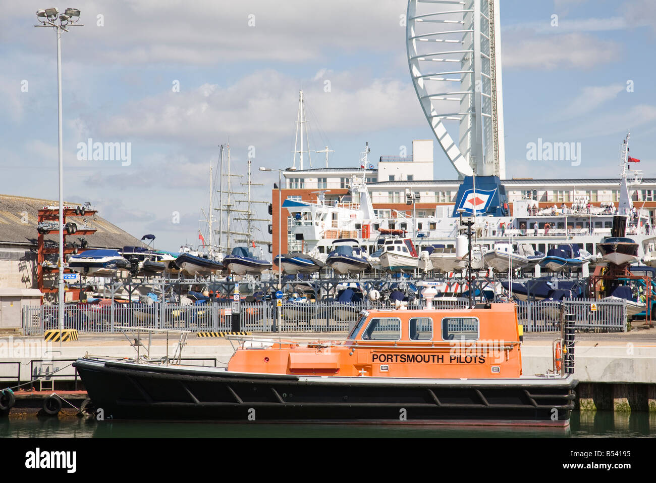 A Pilot boat moored in Camber Dock with the Spinnaker Tower in the ...