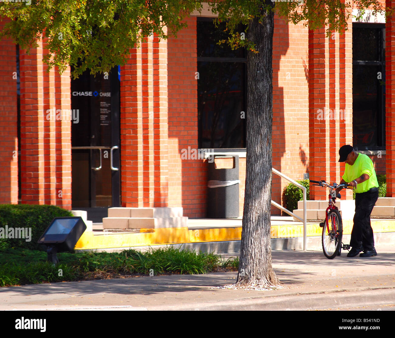Mexican man getting on his bicycle Stock Photo - Alamy