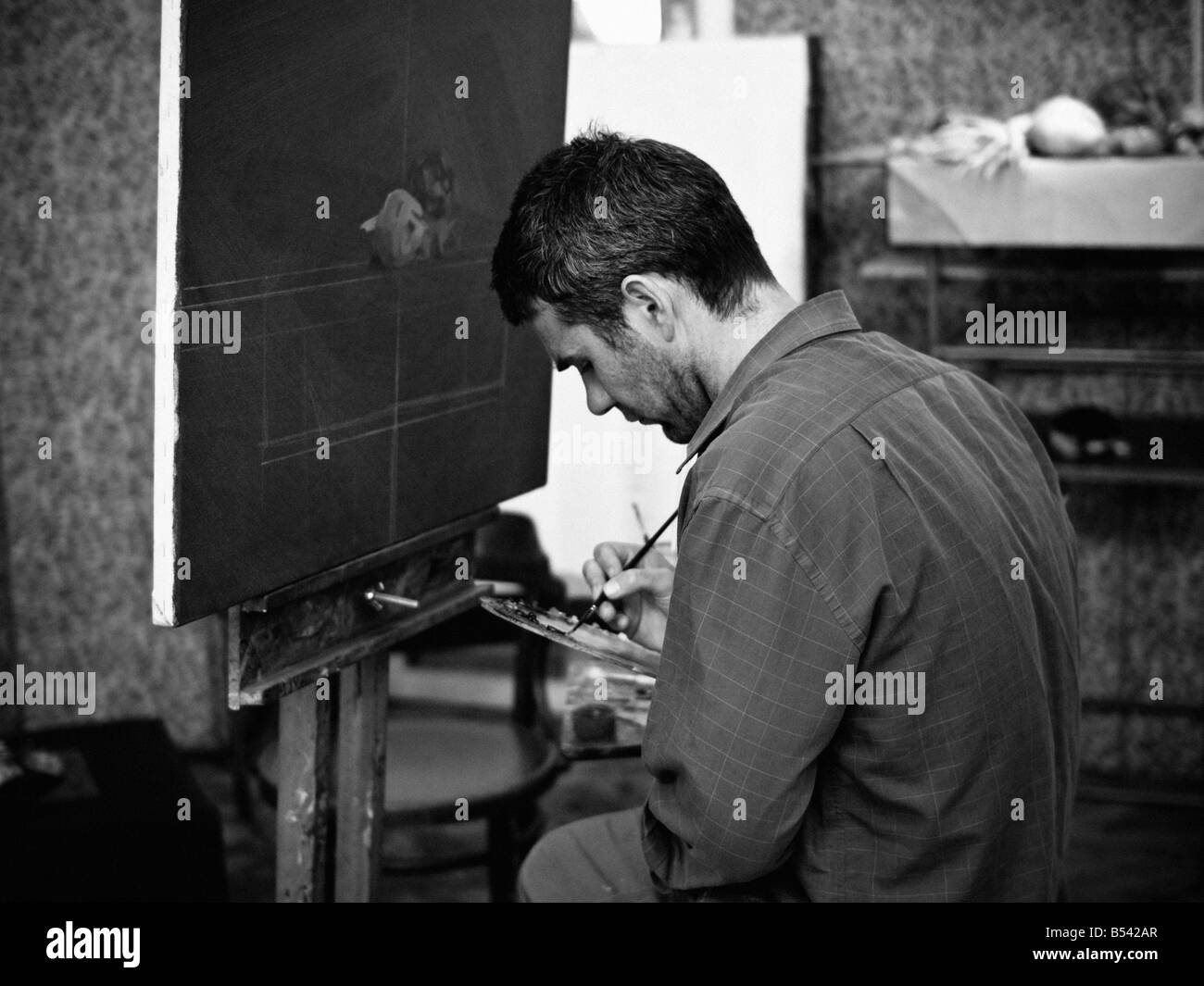 Artist working in his studio at the Old Grammar School, Redruth ...