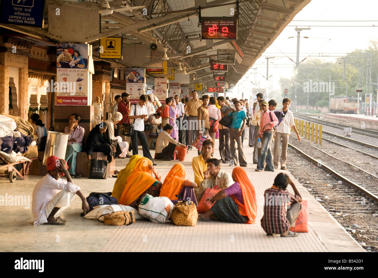 A crowd of passengers wait on the platform, Sawai Madhopur station ...