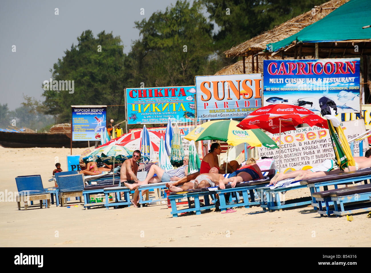 Foreign tourists relax at goan Beach Shacks on Varca Beach in South Goa ...