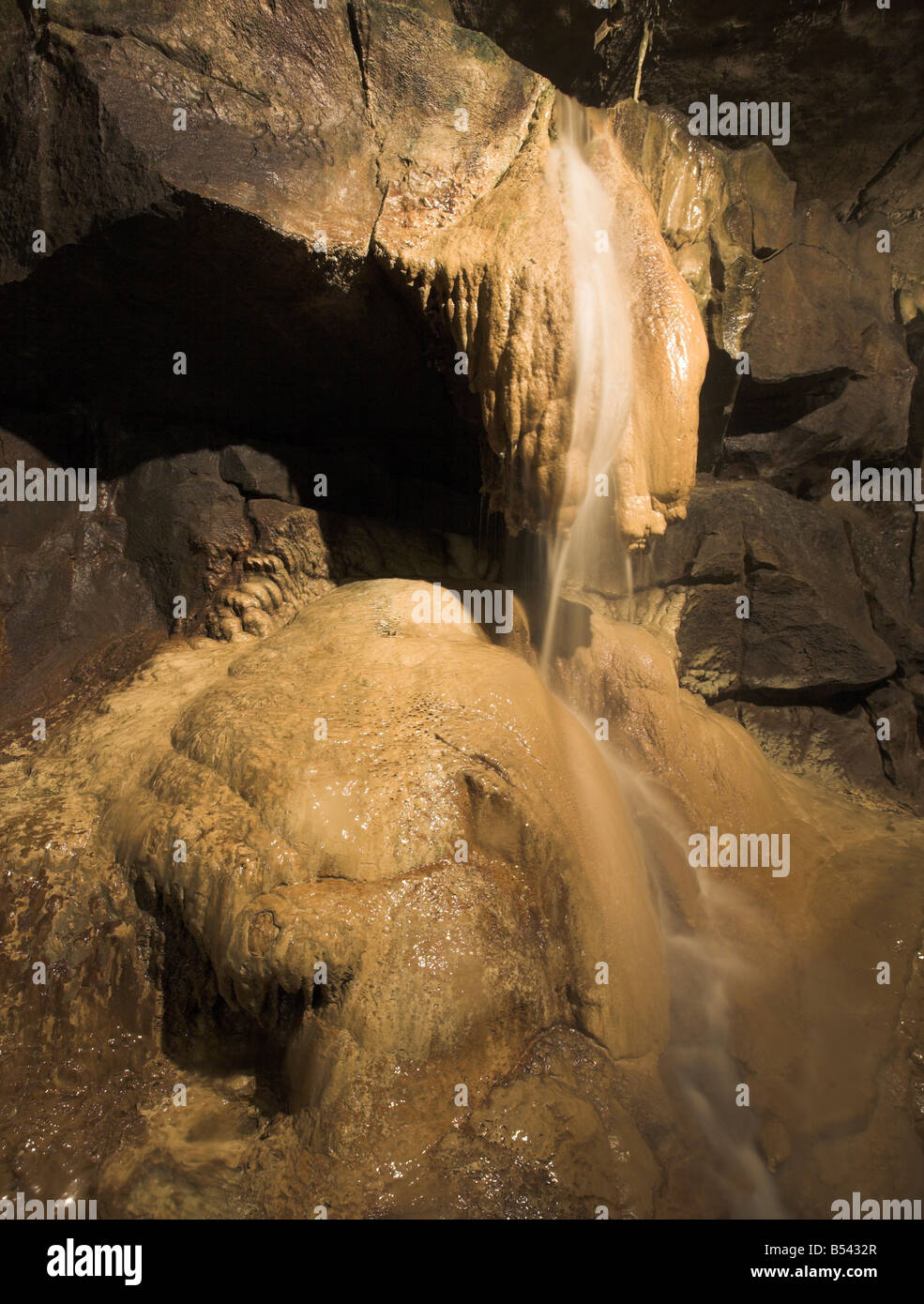 An underground waterfall running over Stalagmites at The Ingleborough ...